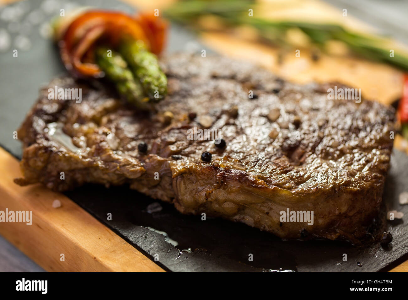 Brown steak on board Stock Photo - Alamy