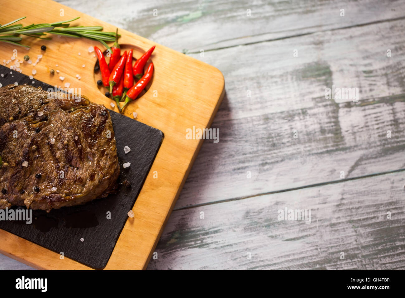 Cooked meat lying on board Stock Photo - Alamy