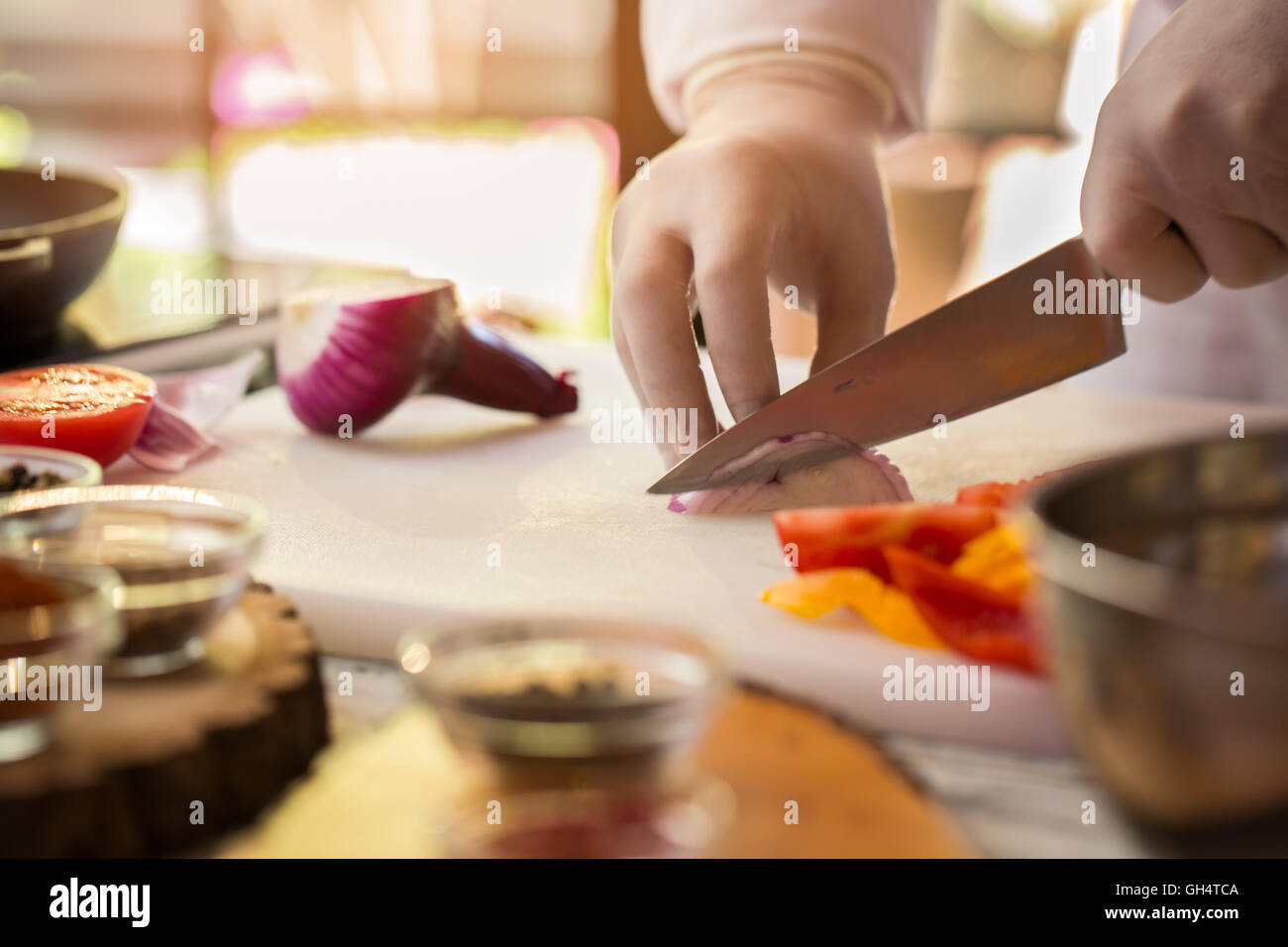 Male hand cutting tomato hi-res stock photography and images - Alamy