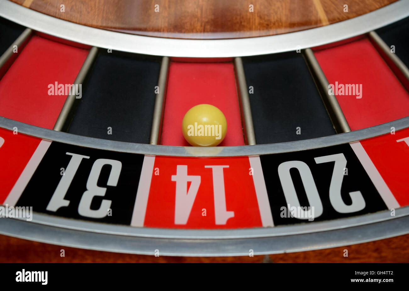 ball in winning number fourteen at roulette wheel Stock Photo - Alamy