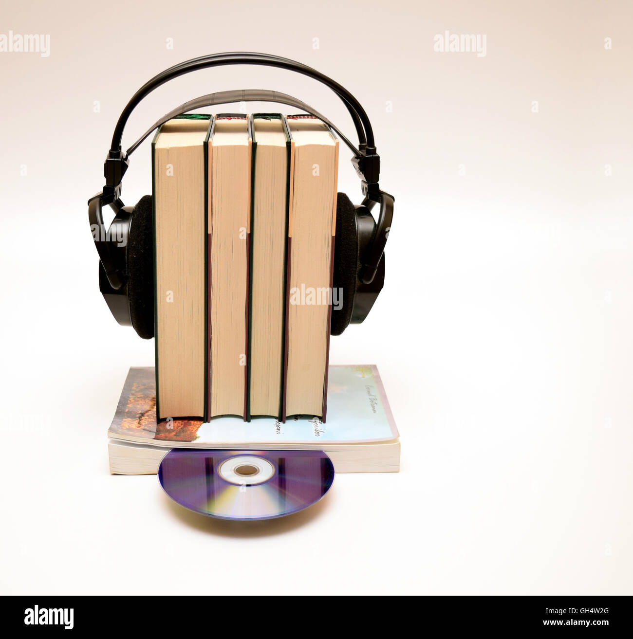 audio headphones and loading cd books with white background isolated ...