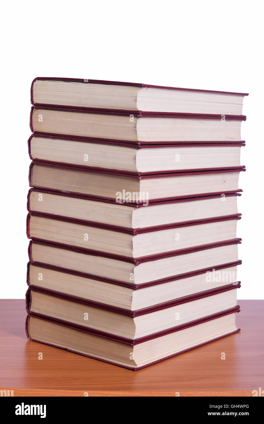 Stack of books arranged the office desk Stock Photo - Alamy