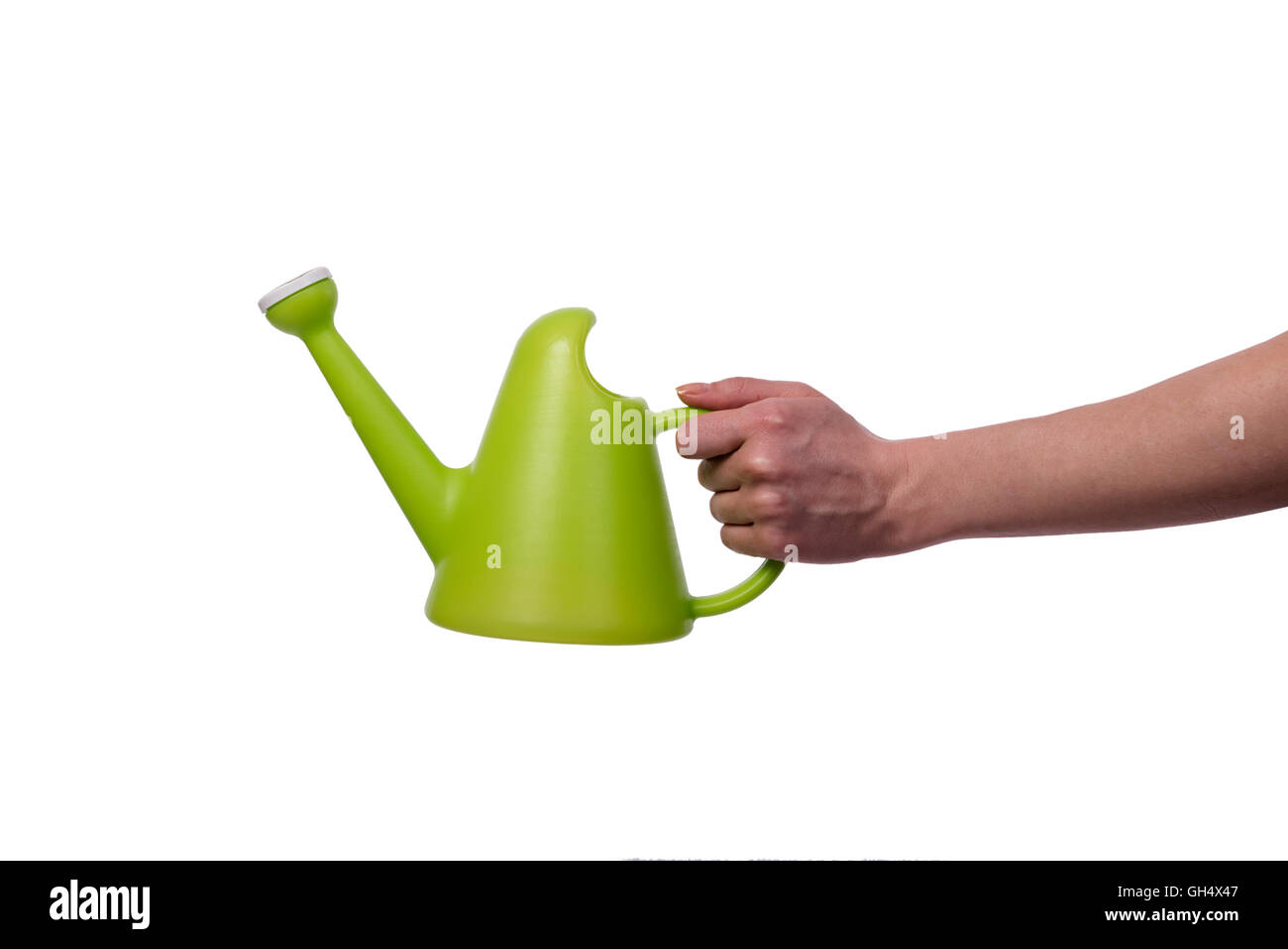 Hand holding watering can isolated on white Stock Photo - Alamy