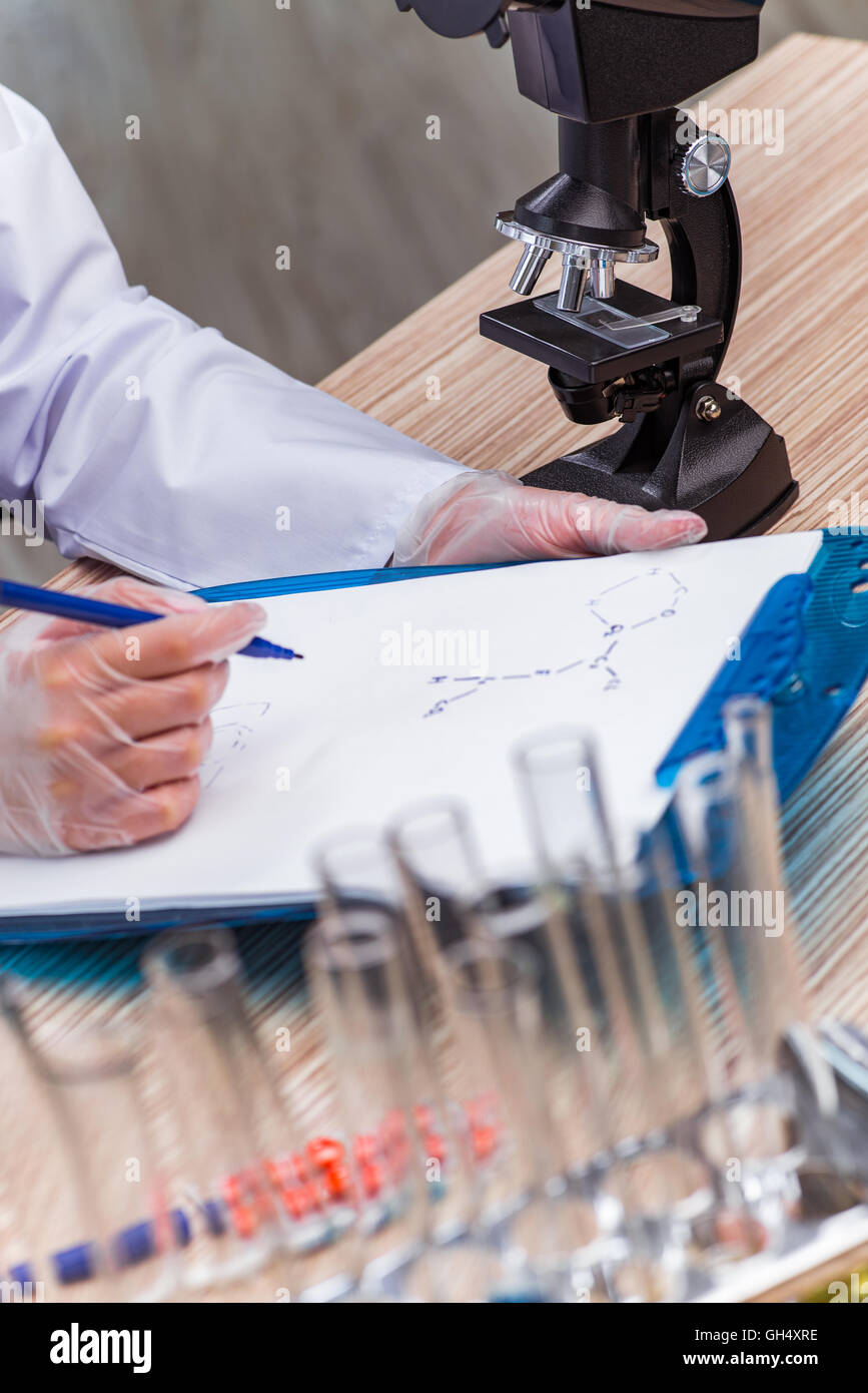 Young student working with chemical solutions in lab Stock Photo - Alamy