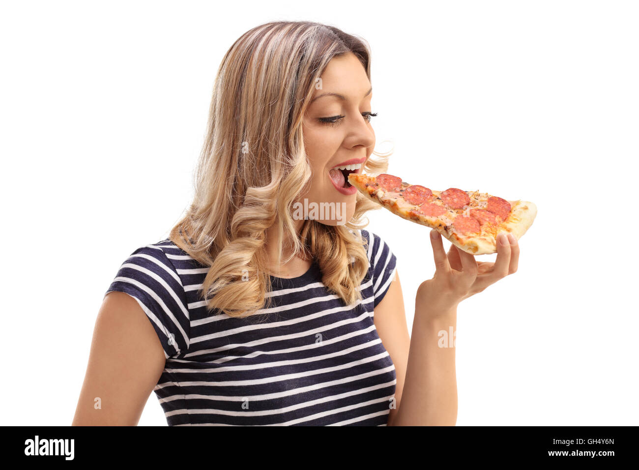 Girl eating slice pepperoni pizza hi-res stock photography and images ...