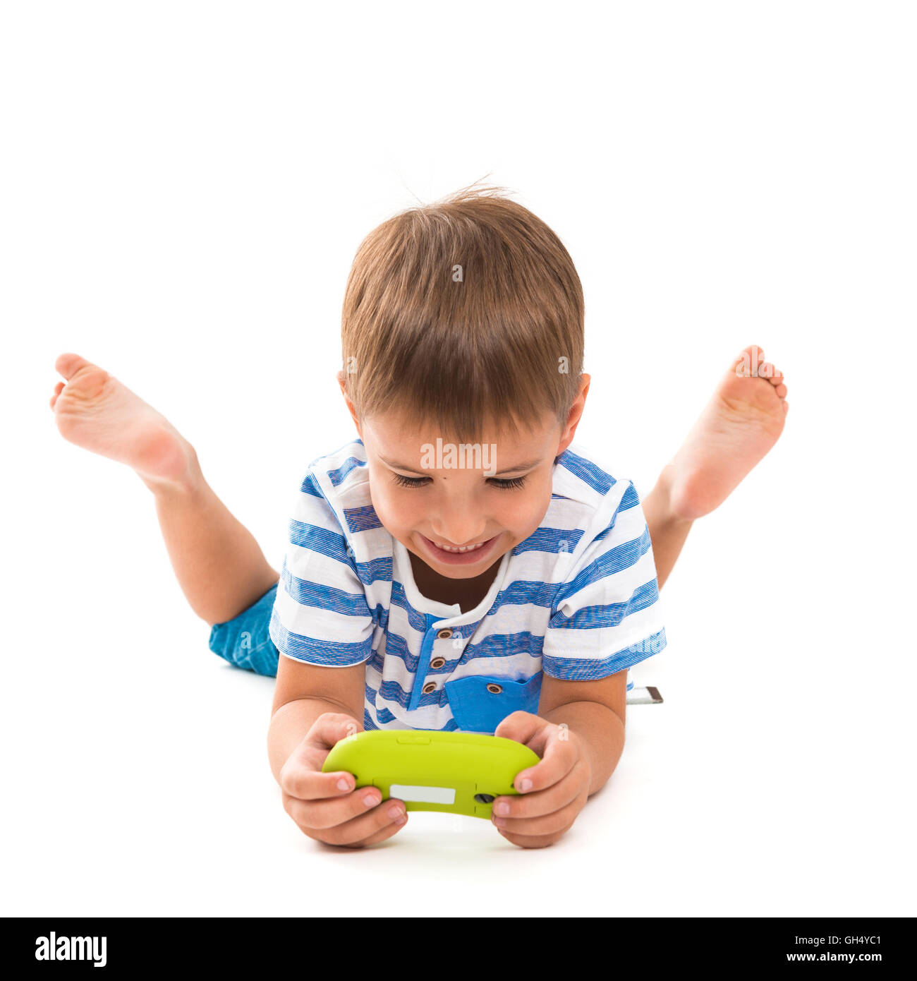 Happy child playing a game console. Photo on a white background Stock ...