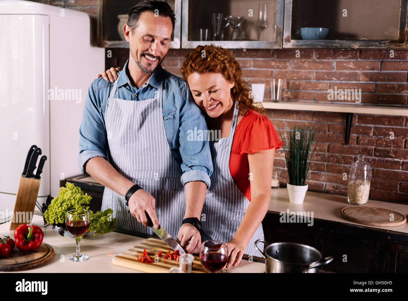 Wife and husband cooking together Stock Photo - Alamy
