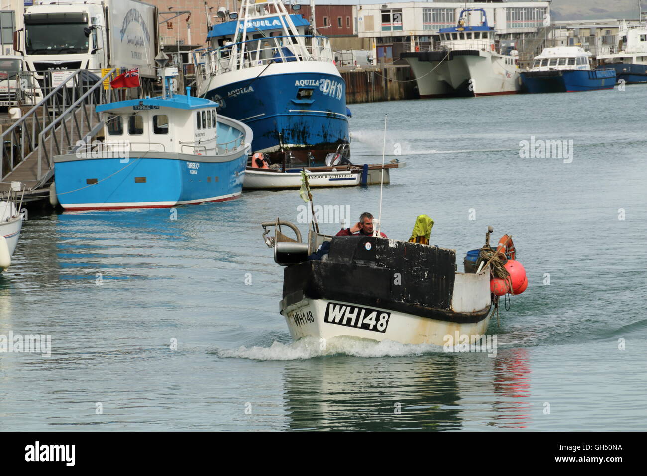 Small boat returning to Weymouth Harbour,Dorset,UK Stock Photo - Alamy