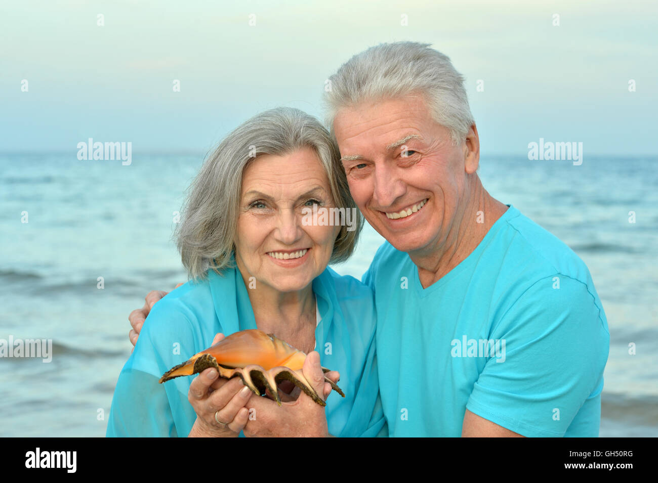 elderly couple rest at tropical resort Stock Photo - Alamy