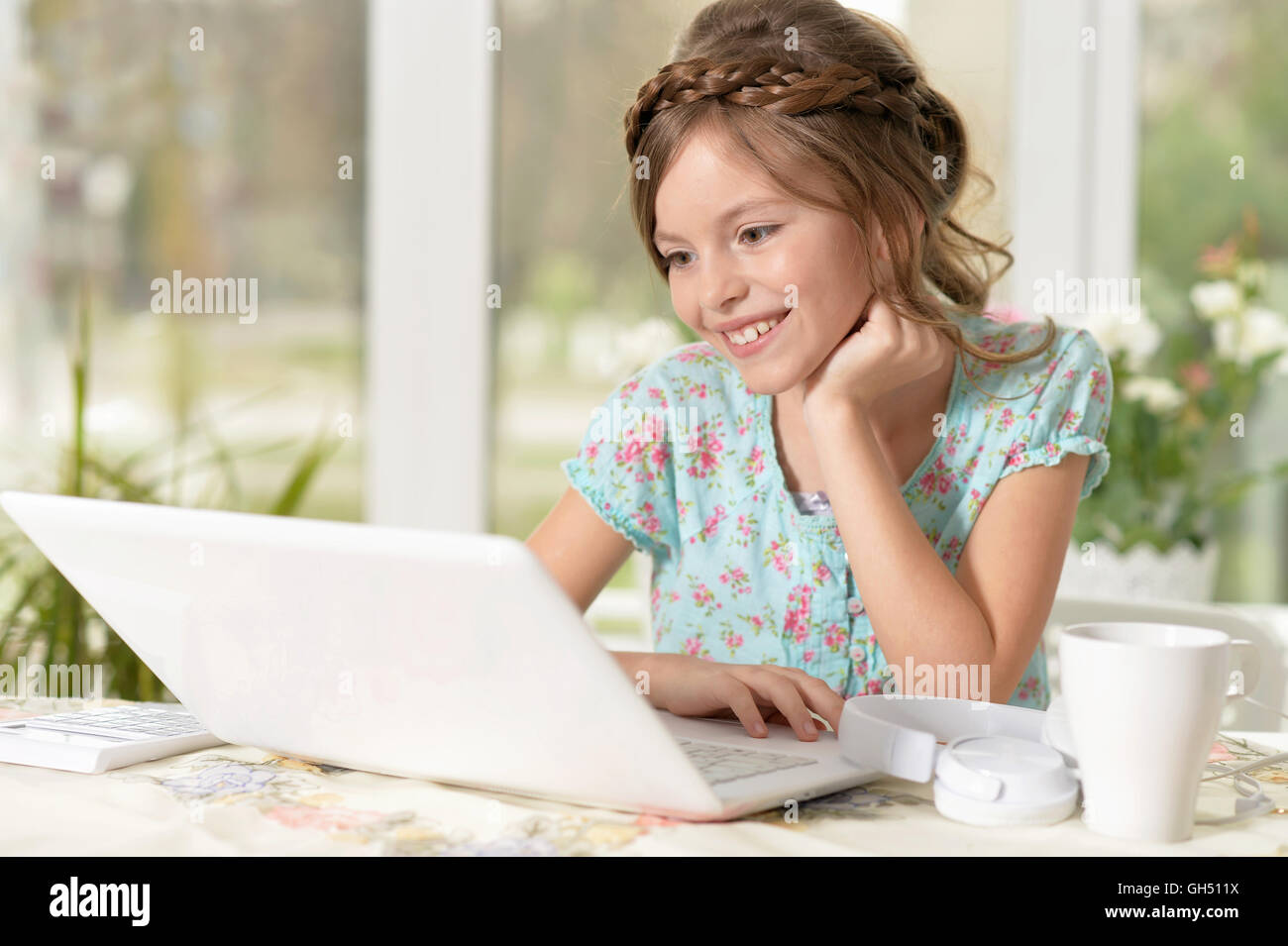 Little girl using computer Stock Photo - Alamy