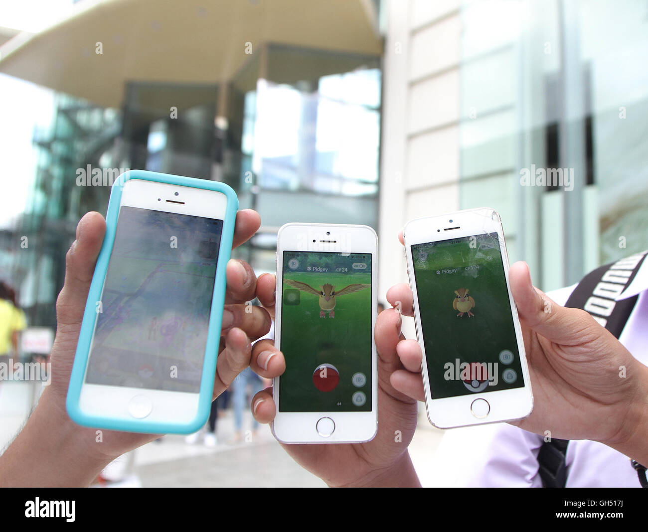 Thai teens play Pokémon GO at center shopping Paragon. Thailand game ...
