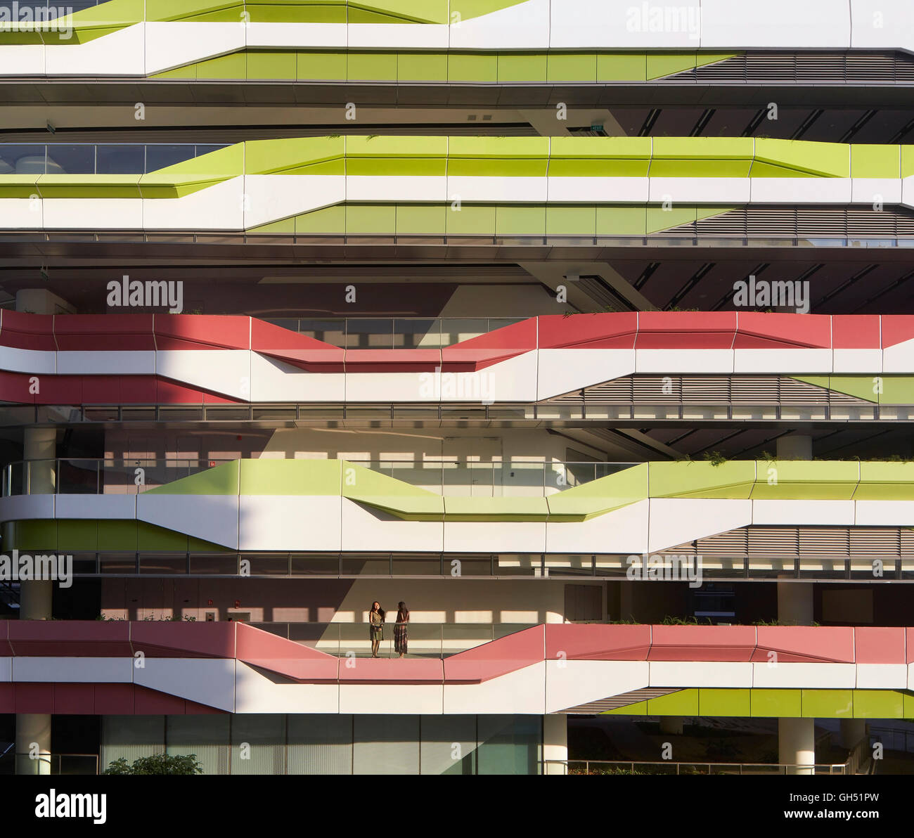 Multi-storey walkway galleries with colored cladding. Singapore ...