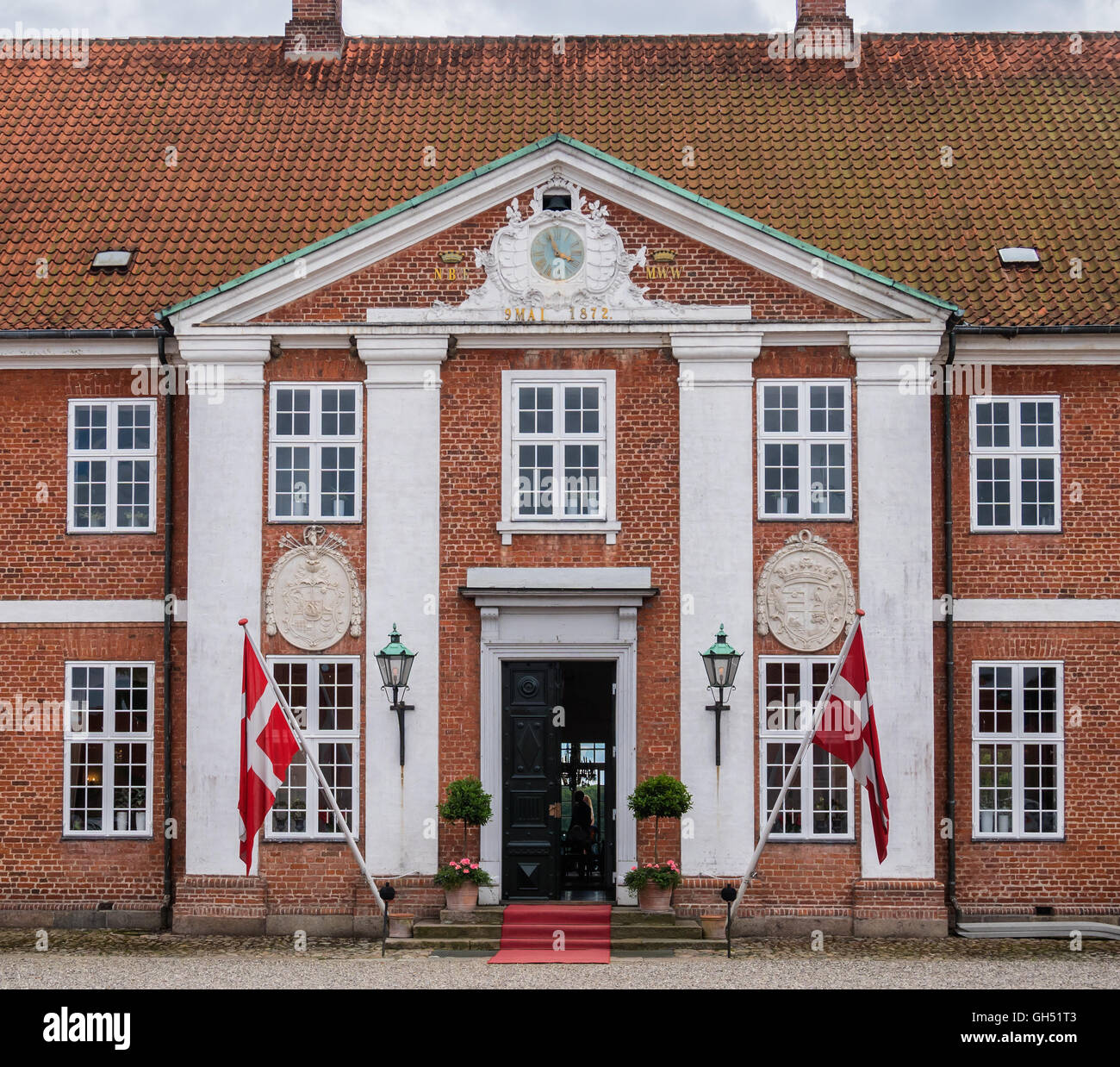 Hindsgavl Castle main entrance with flags, Denmark Stock Photo - Alamy