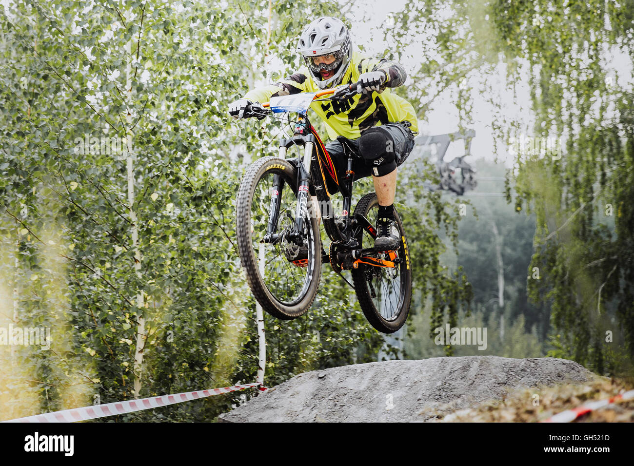 young rider athlete on bicycle jump over obstacles during National ...