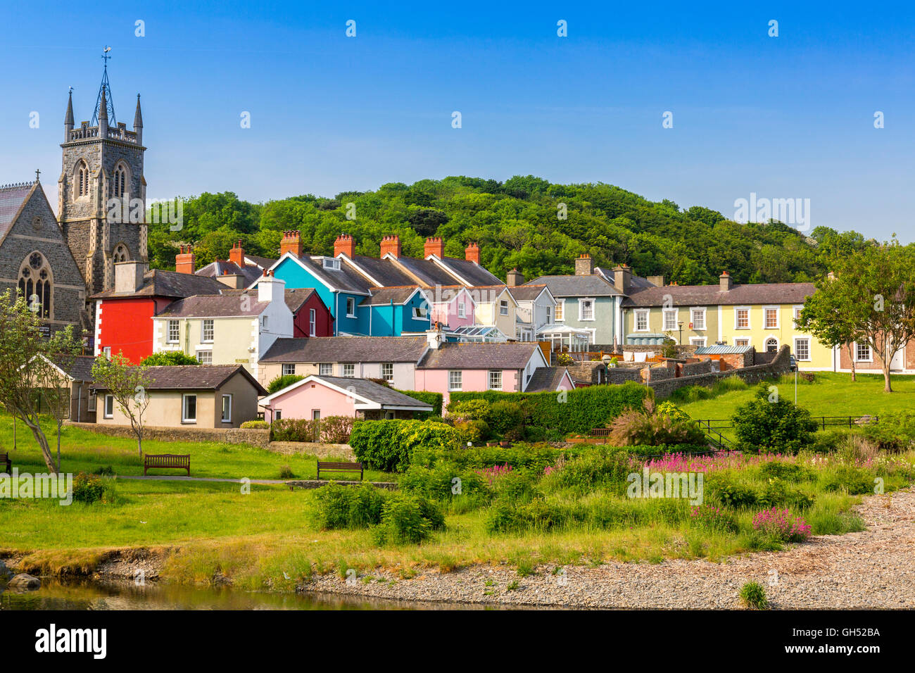 Colourful terraces of houses overlook the harbour and River Aeron at ...