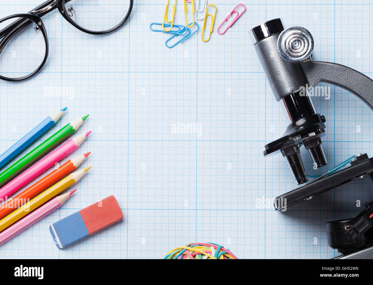 School supplies over paper for your text. Back to school concept with ...