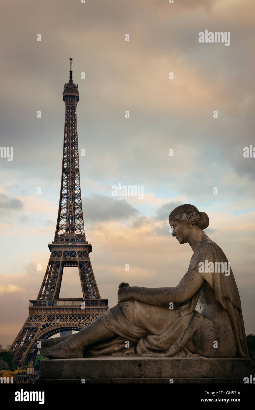Eiffel Tower with statue as the famous landmark in Paris, France Stock ...