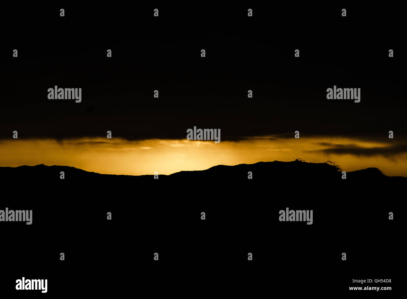 Sunset inside the ocean with wave silhouette Stock Photo - Alamy