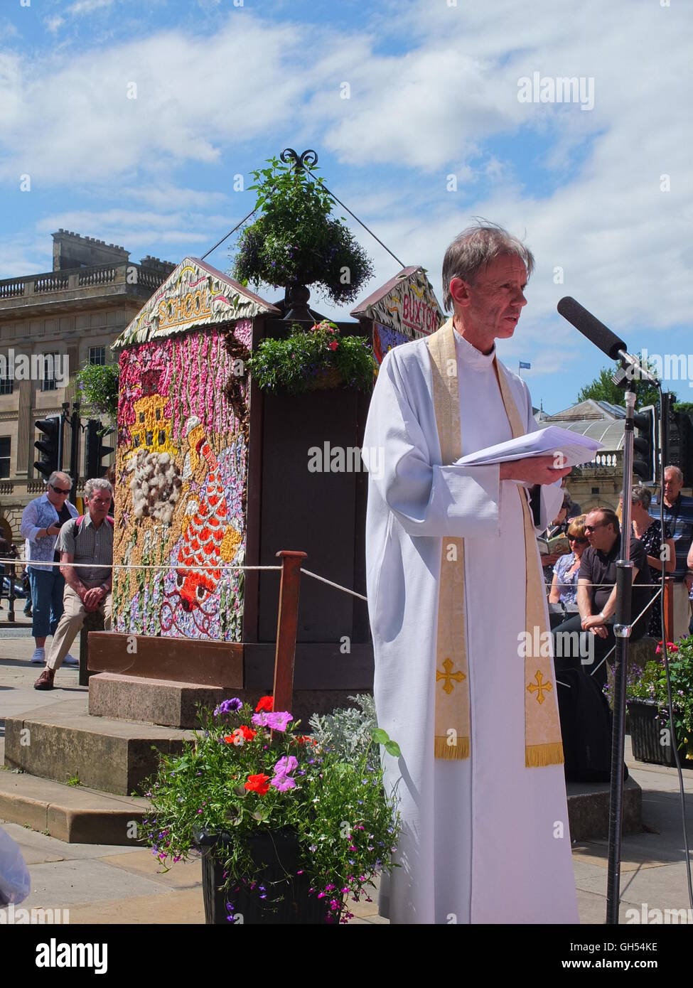 A vicar blessing the Spring Gardens well dressing in Buxton, Derbyshire ...