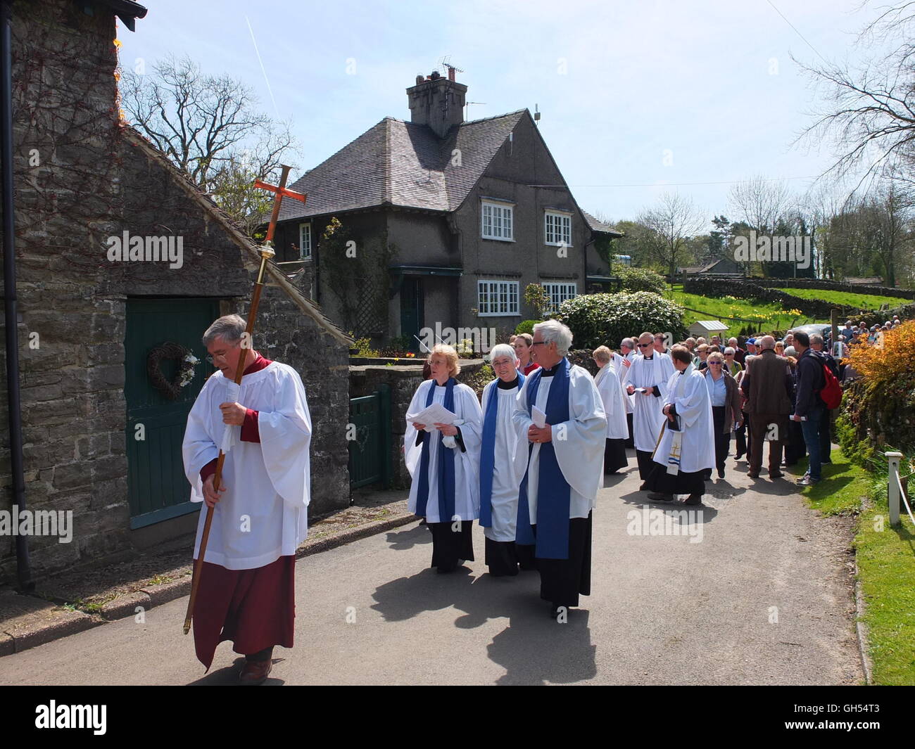 Members of the clergy and visitors process to bless the well dressings ...