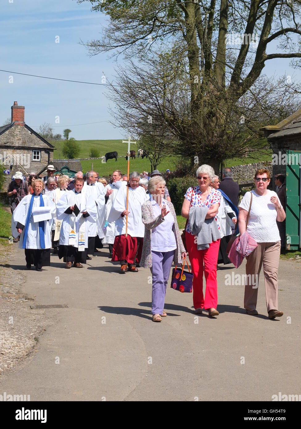Members of the clergy and visitors process to bless the well dressings ...
