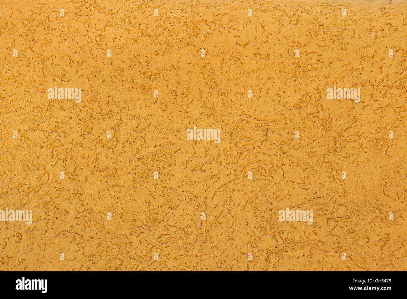 Yellow ochre painted stucco wall. Background texture Stock Photo - Alamy