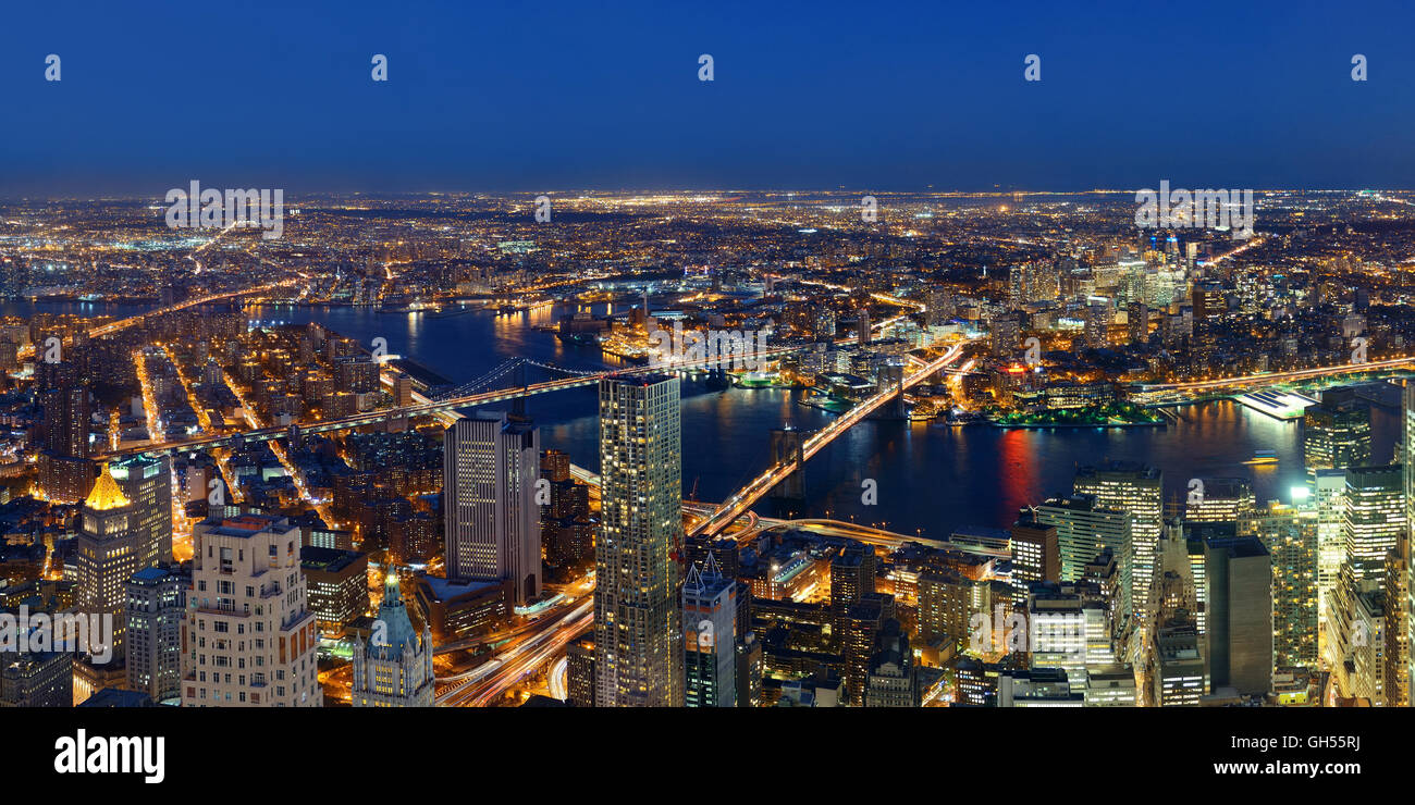 Rooftop night panorama view of New York City downtown with urban ...