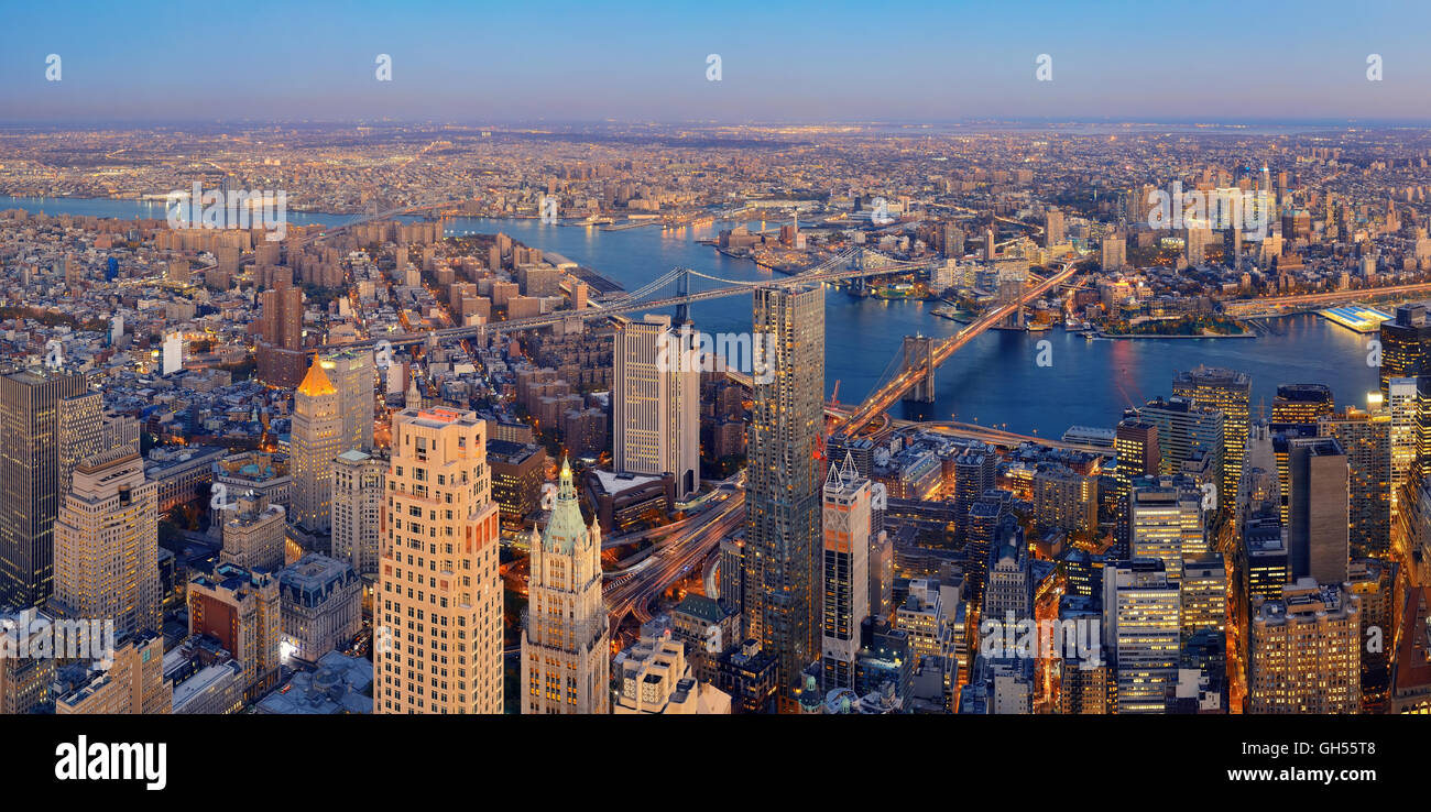 Manhattan downtown sunset rooftop panorama view with urban skyscrapers ...