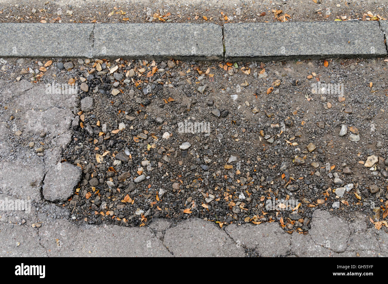 Cracked and damaged asphalt pavement Stock Photo - Alamy
