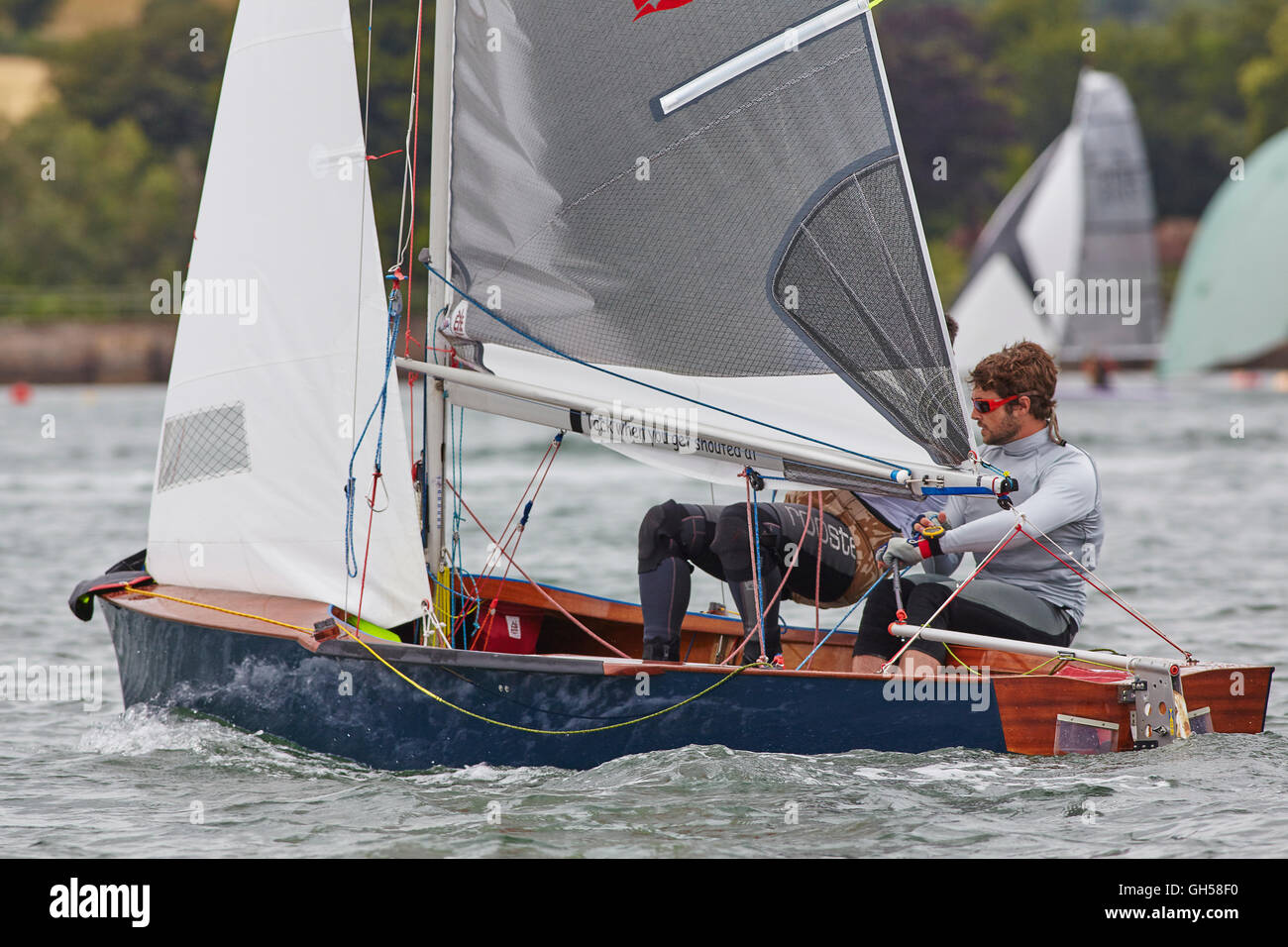 Competitive sailing dinghy racing, in the estuary of the River Exe ...