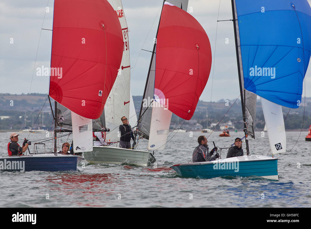 Competitive sailing dinghy racing, in the estuary of the River Exe ...