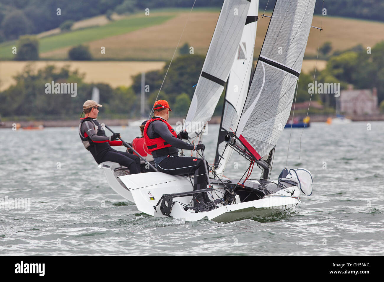 Competitive sailing dinghy racing, in the estuary of the River Exe ...