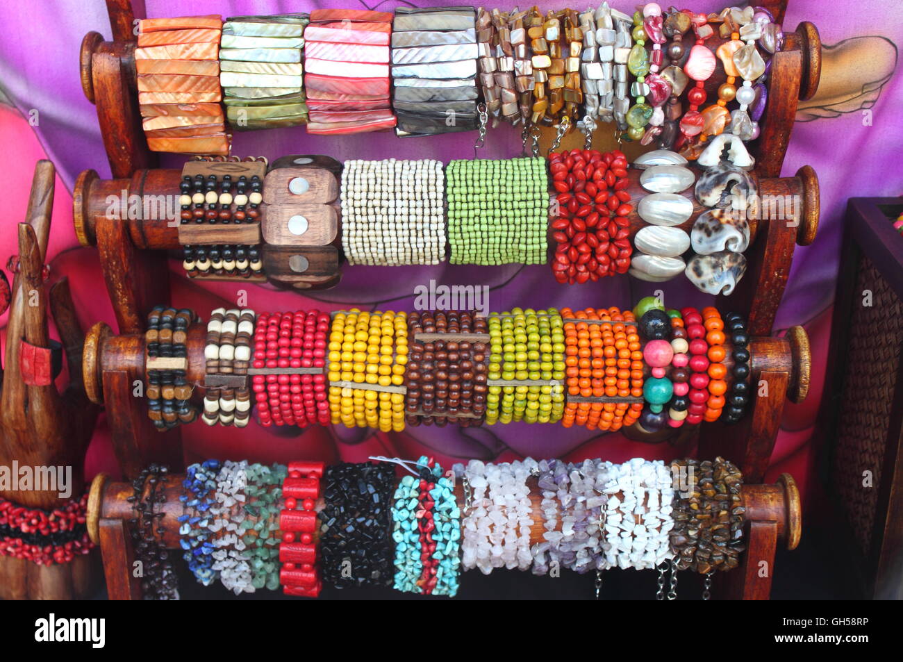 Stand with various colorful bracelets Stock Photo - Alamy