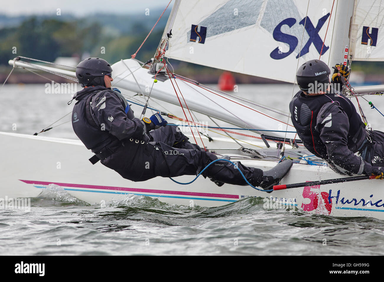 Competitive sailing dinghy racing, in the estuary of the River Exe ...