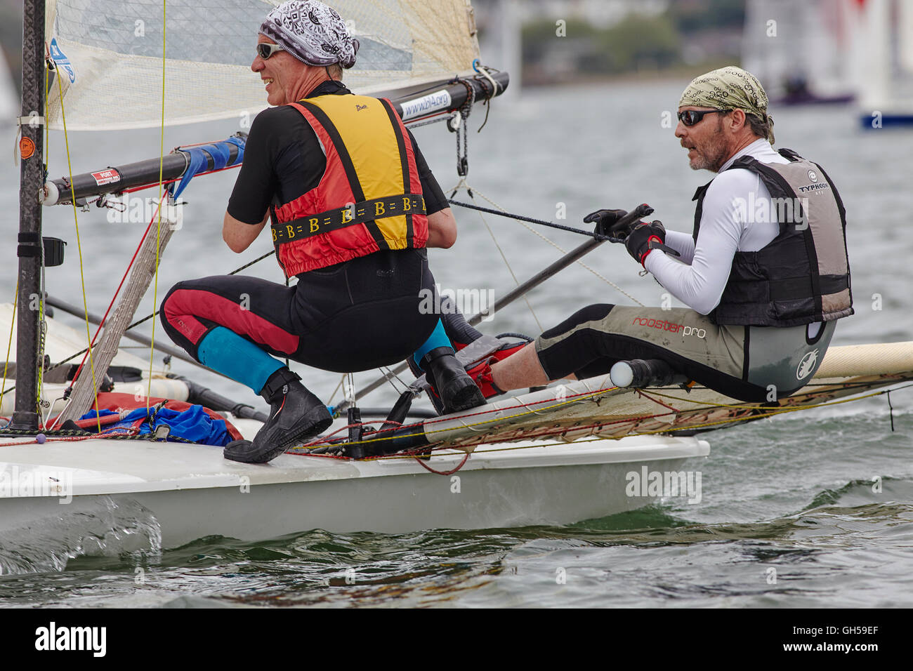 Competitive sailing dinghy racing, in the estuary of the River Exe ...