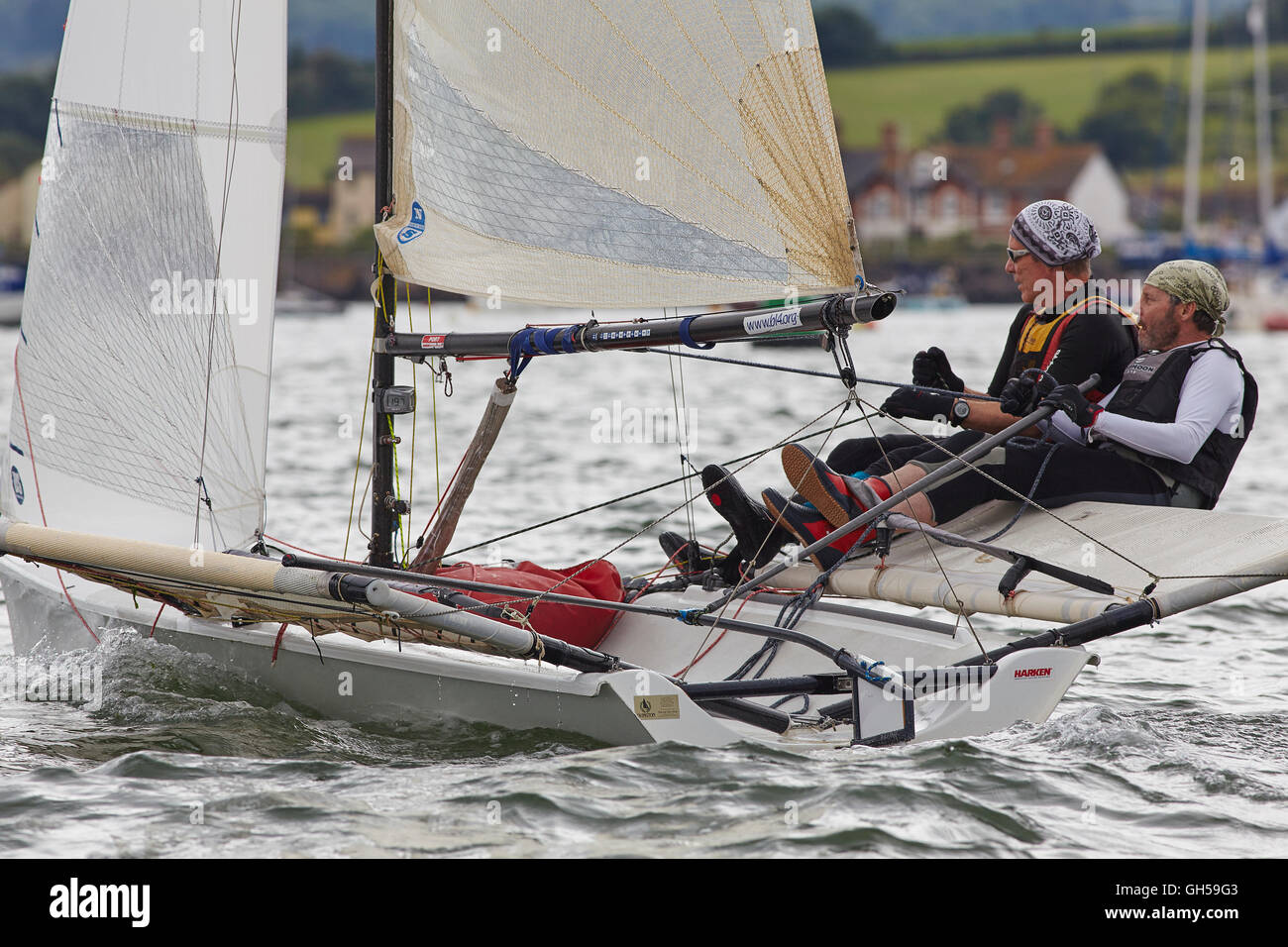 Competitive sailing dinghy racing, in the estuary of the River Exe ...