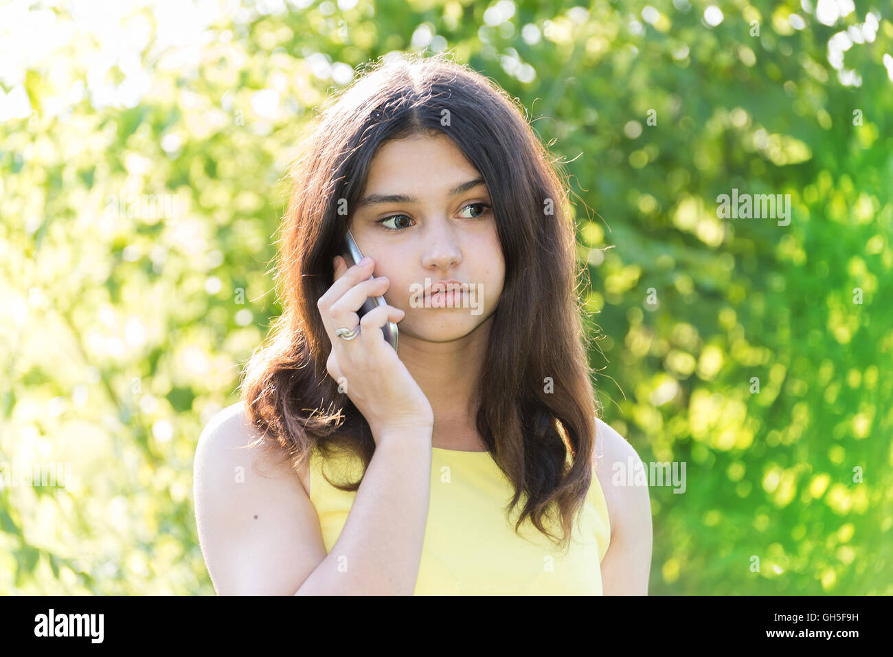 Girl talking on phone hi-res stock photography and images - Alamy