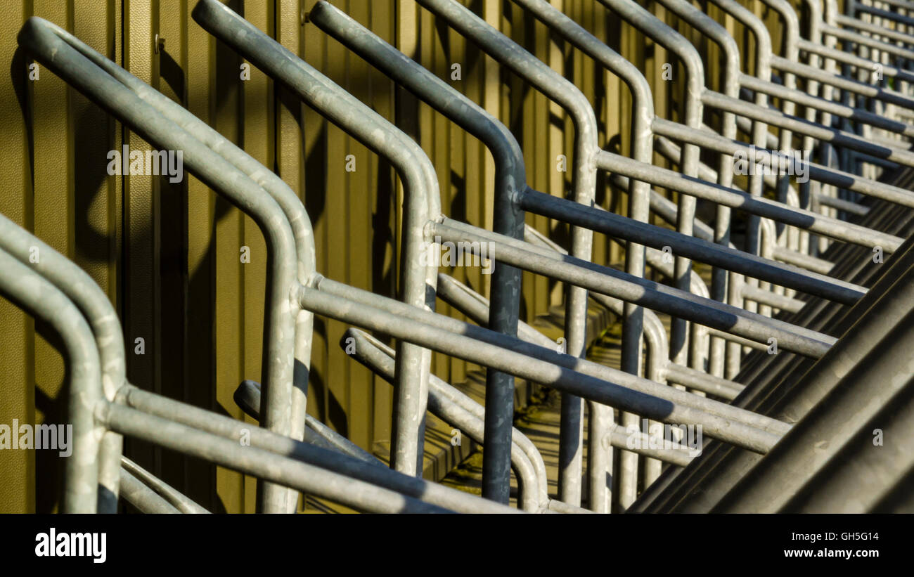 Empty bike metal rack showing rhythm and structure Stock Photo - Alamy