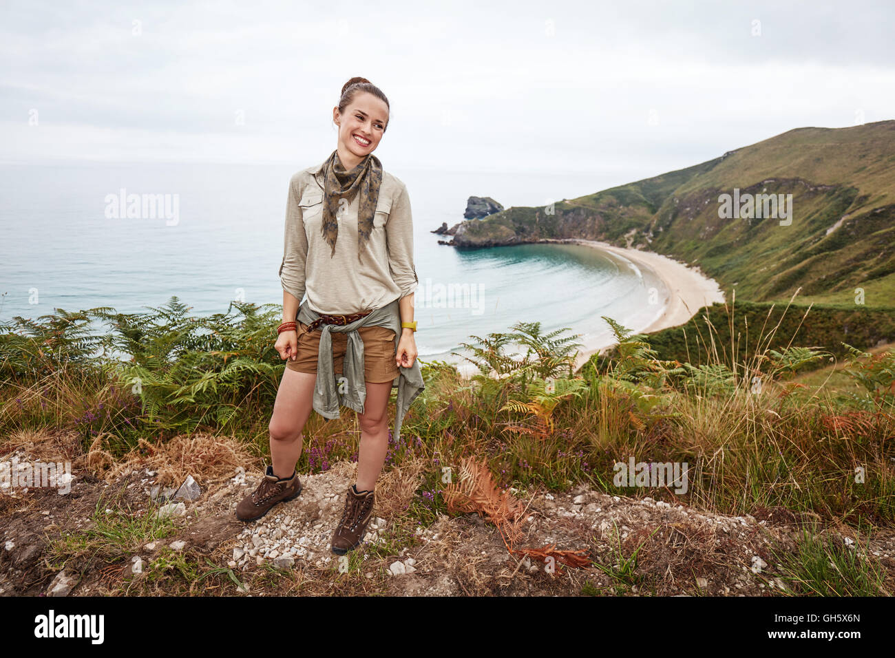 Into the wild in Spain. Full length portrait of smiling adventure woman ...