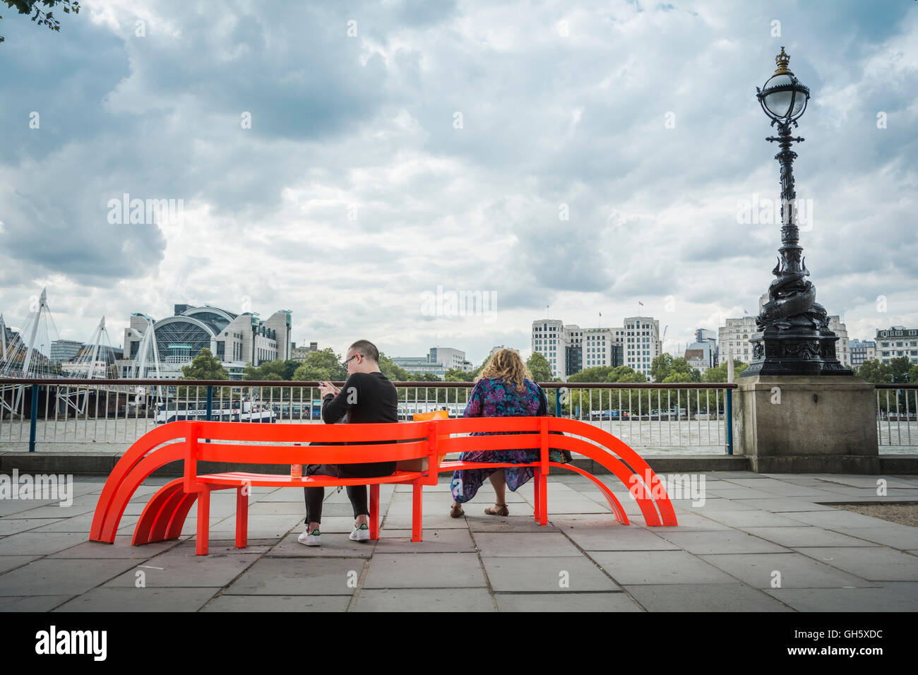 A couple sitting on one of by Jeppe Hein's Modified Social Benches on ...