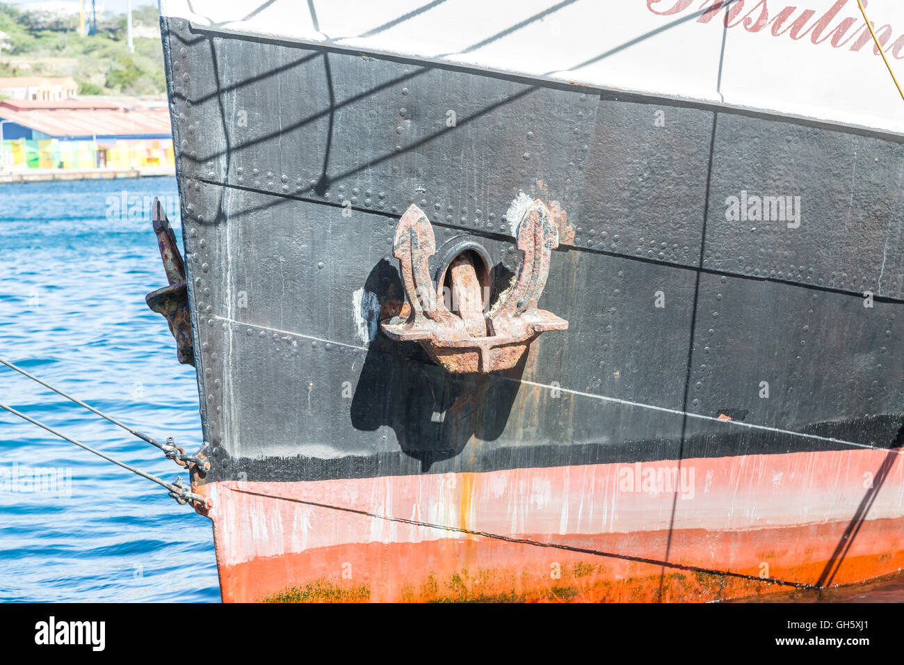 Rusty Anchor on Black Hull of tanker Stock Photo - Alamy