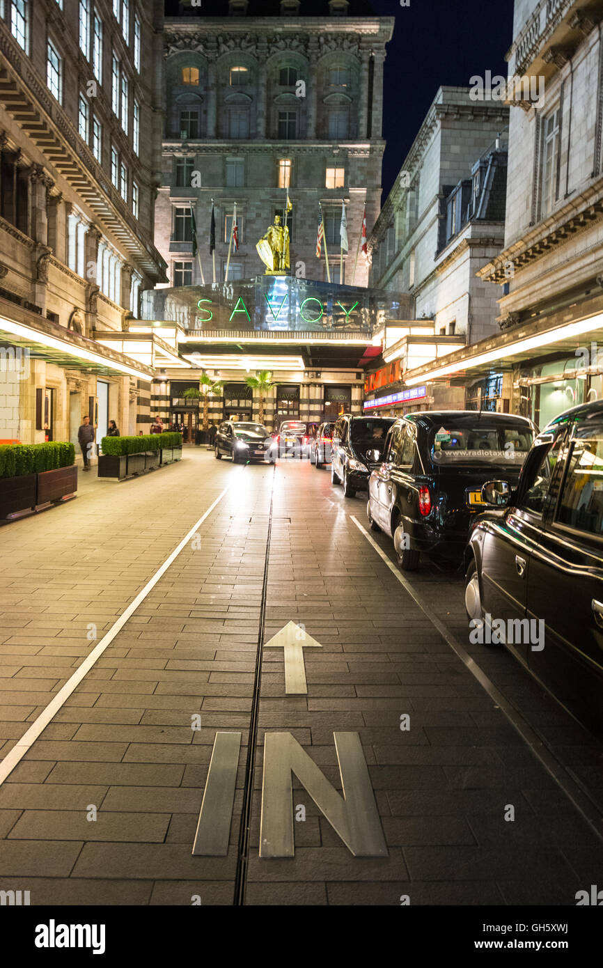 The entrance to the Savoy Hotel in Savoy Court on the Strand in London ...