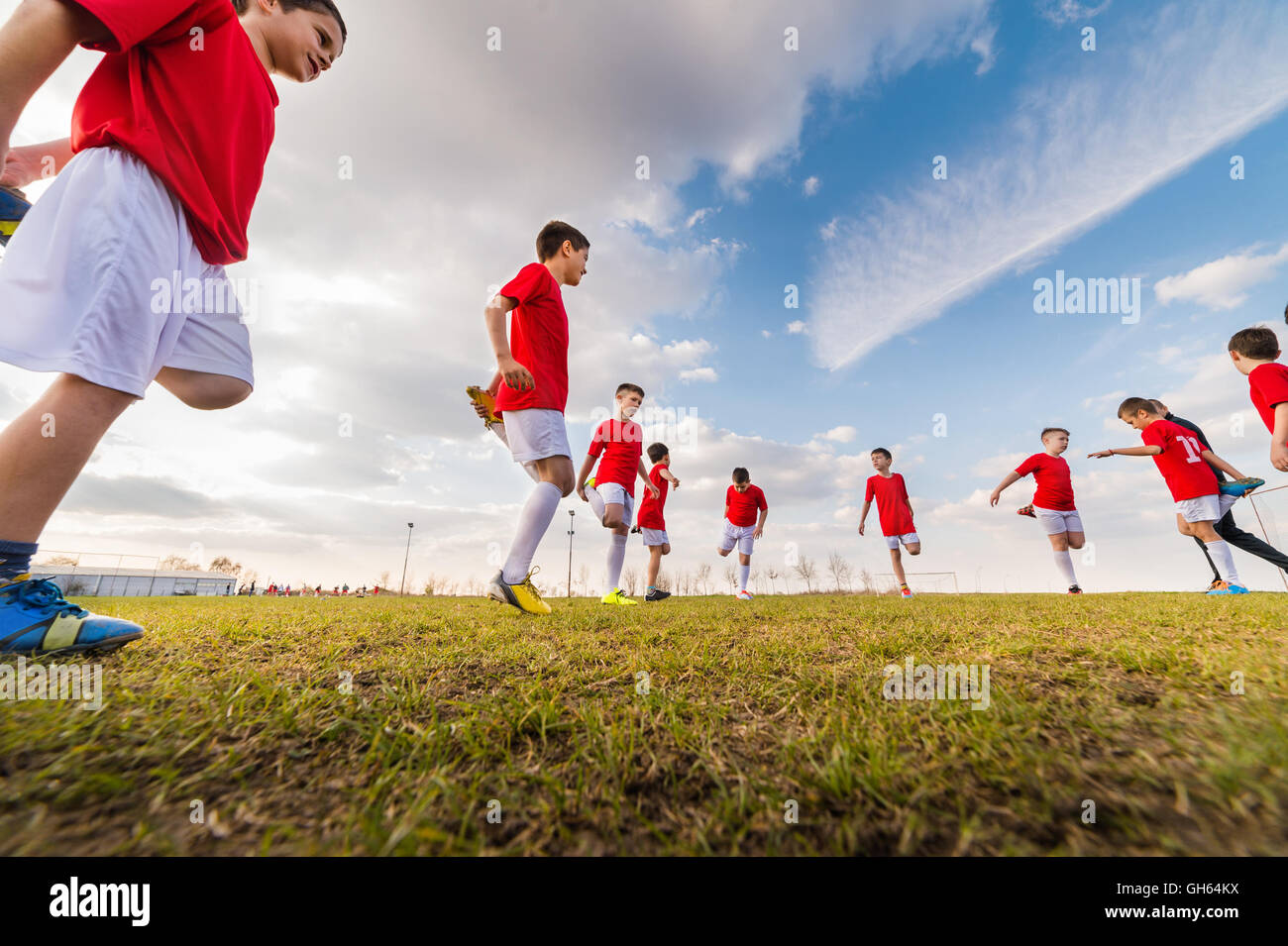Kids soccer team exercise on soccer field Stock Photo - Alamy