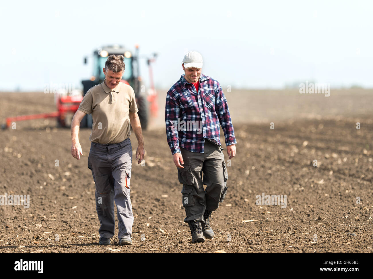 father and son working in agriculture Stock Photo - Alamy