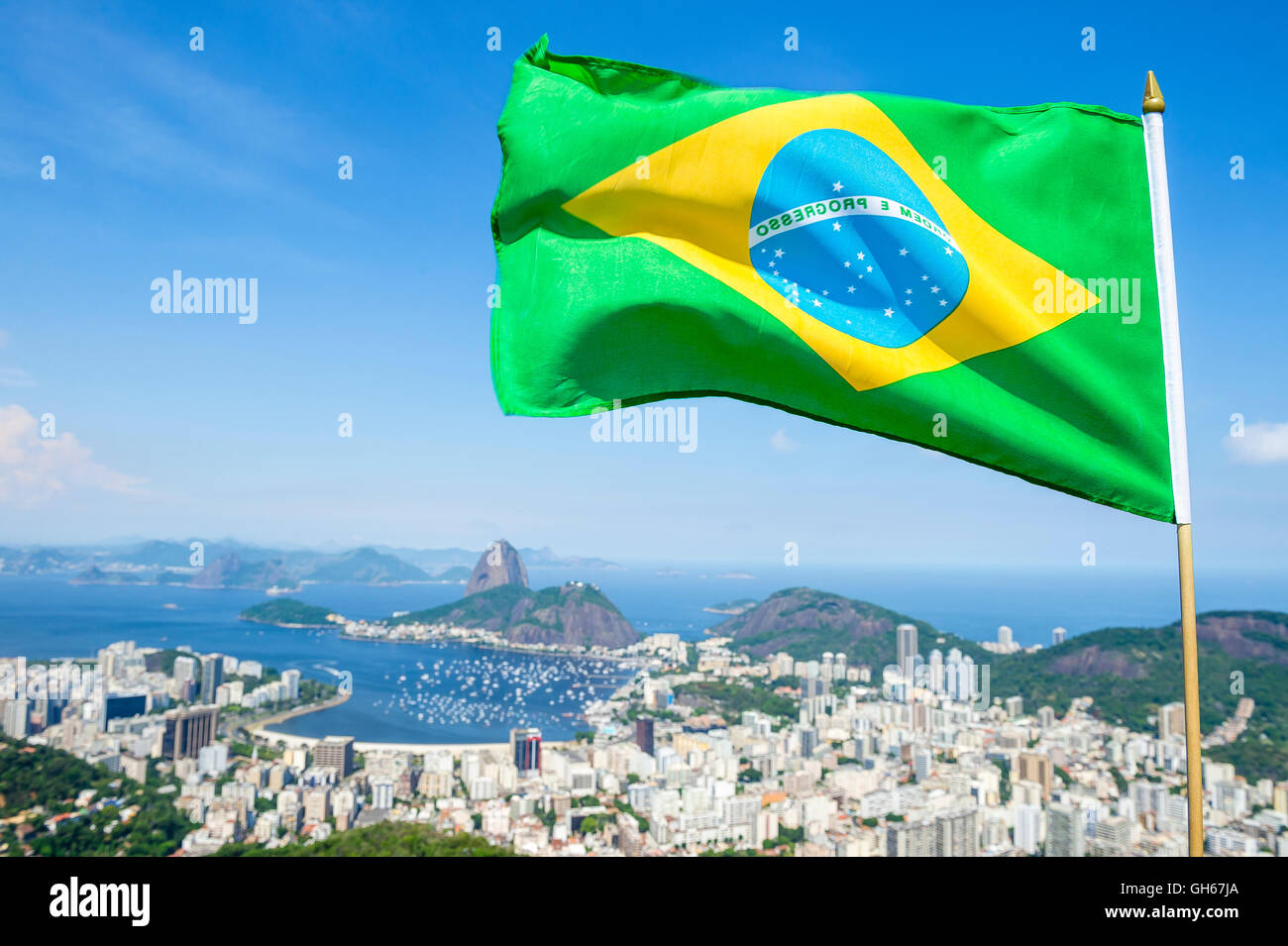 Brazilian flag flying above a scenic overlook of the city skyline of ...