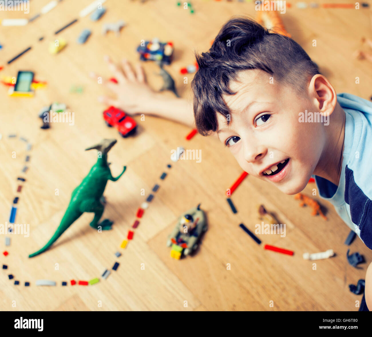 little cute preschooler boy playing lego toys at home happy smiling ...