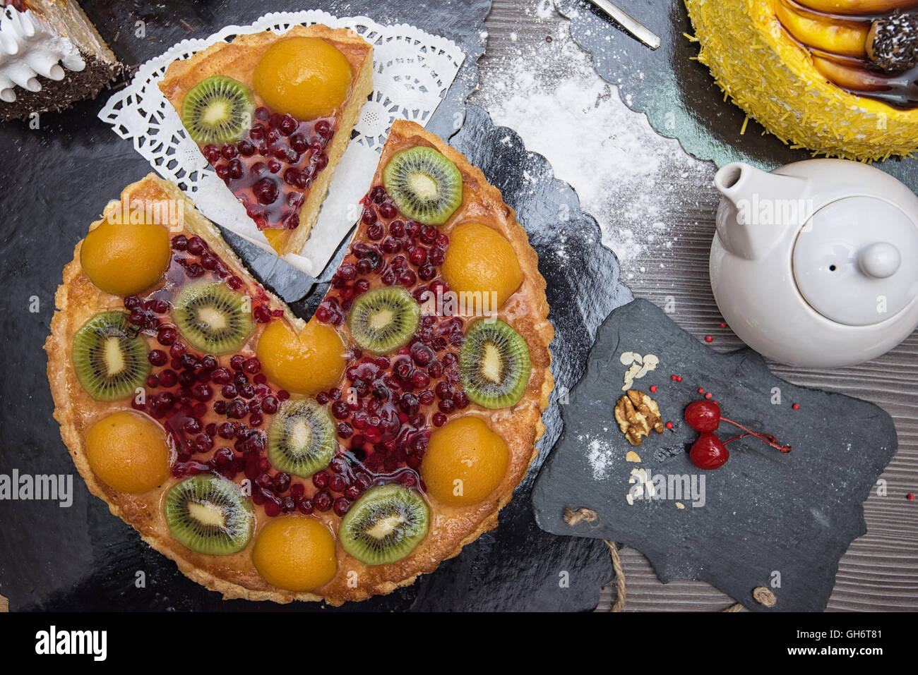 Table with fruit cakes Stock Photo - Alamy