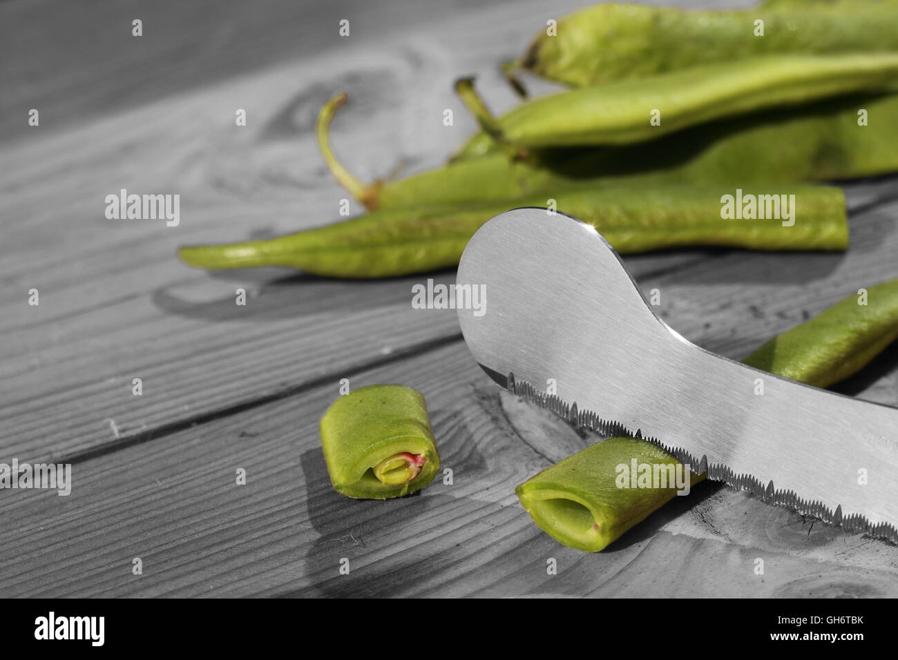 Selective color image of green beans being cut with a knife Stock Photo ...