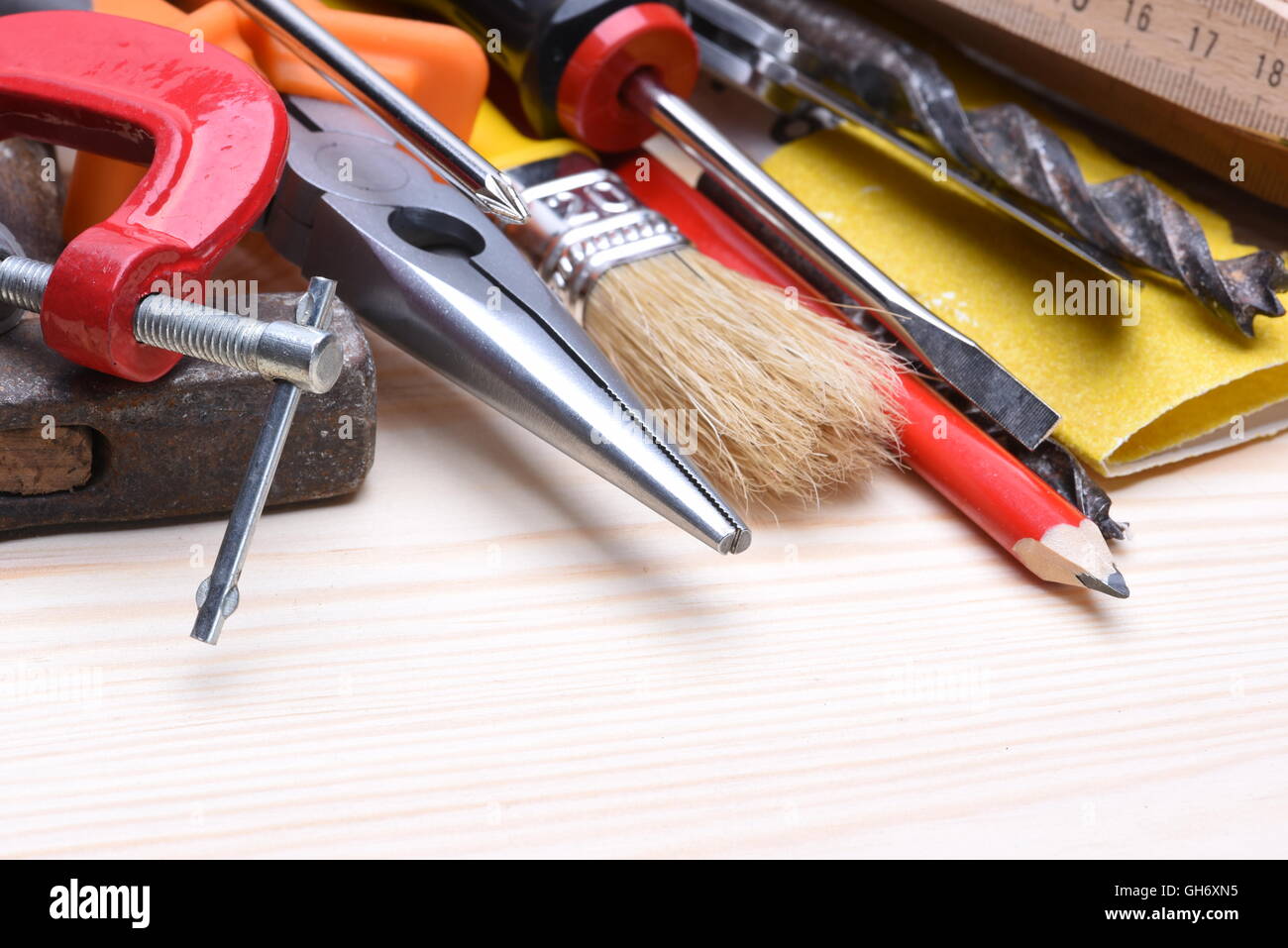 Set of working tools on wooden board Stock Photo - Alamy