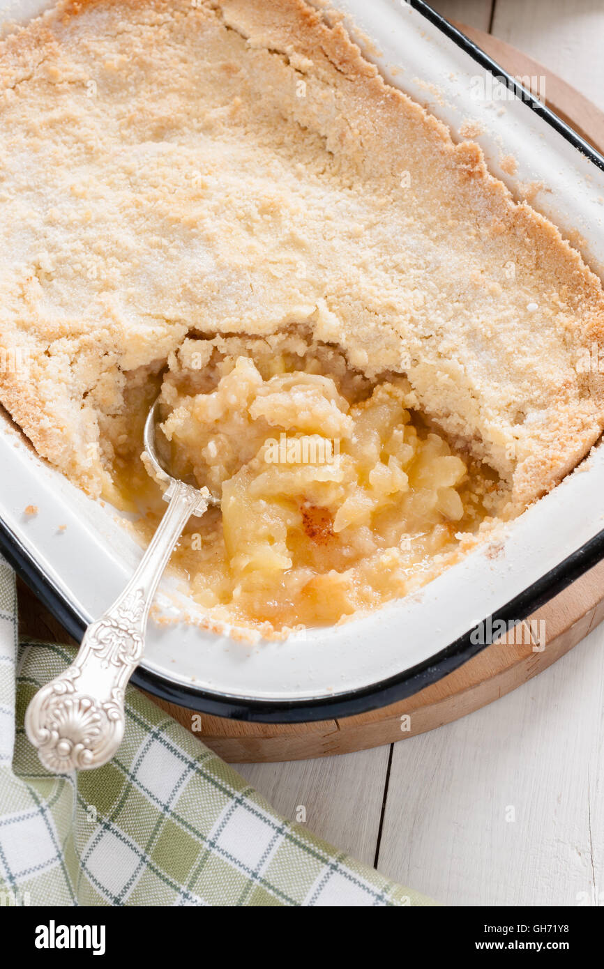 Home made Bramley apple crumble or apple cobbler stewed fruit with a ...